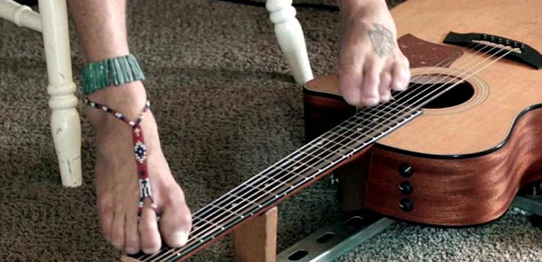 MAN PLAYS GUITAR WITH HIS FEET - Mixdown Magazine